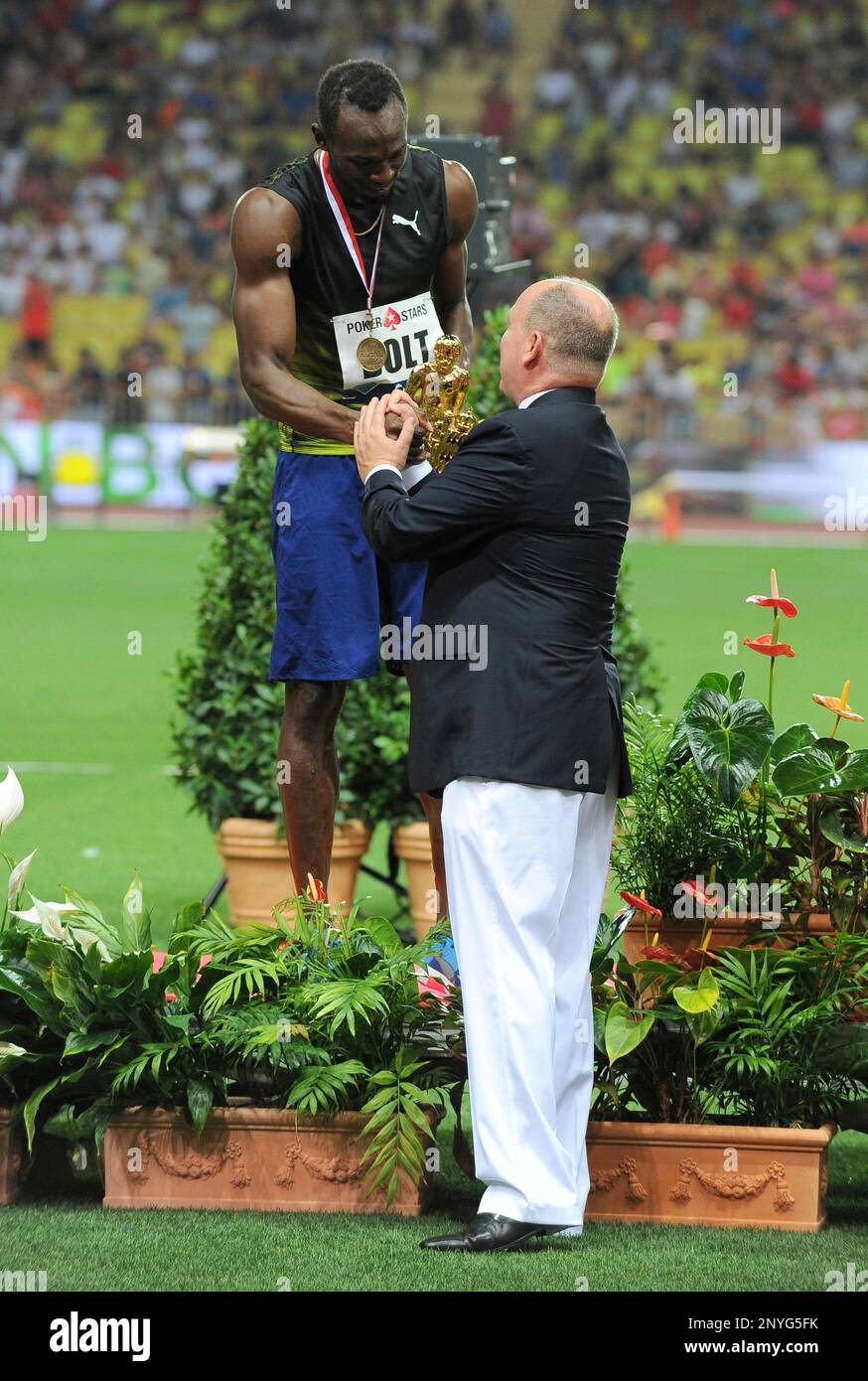 Usain Bolt (JAM) is congratulated by Prince Albert II (Albert Alexandre ...