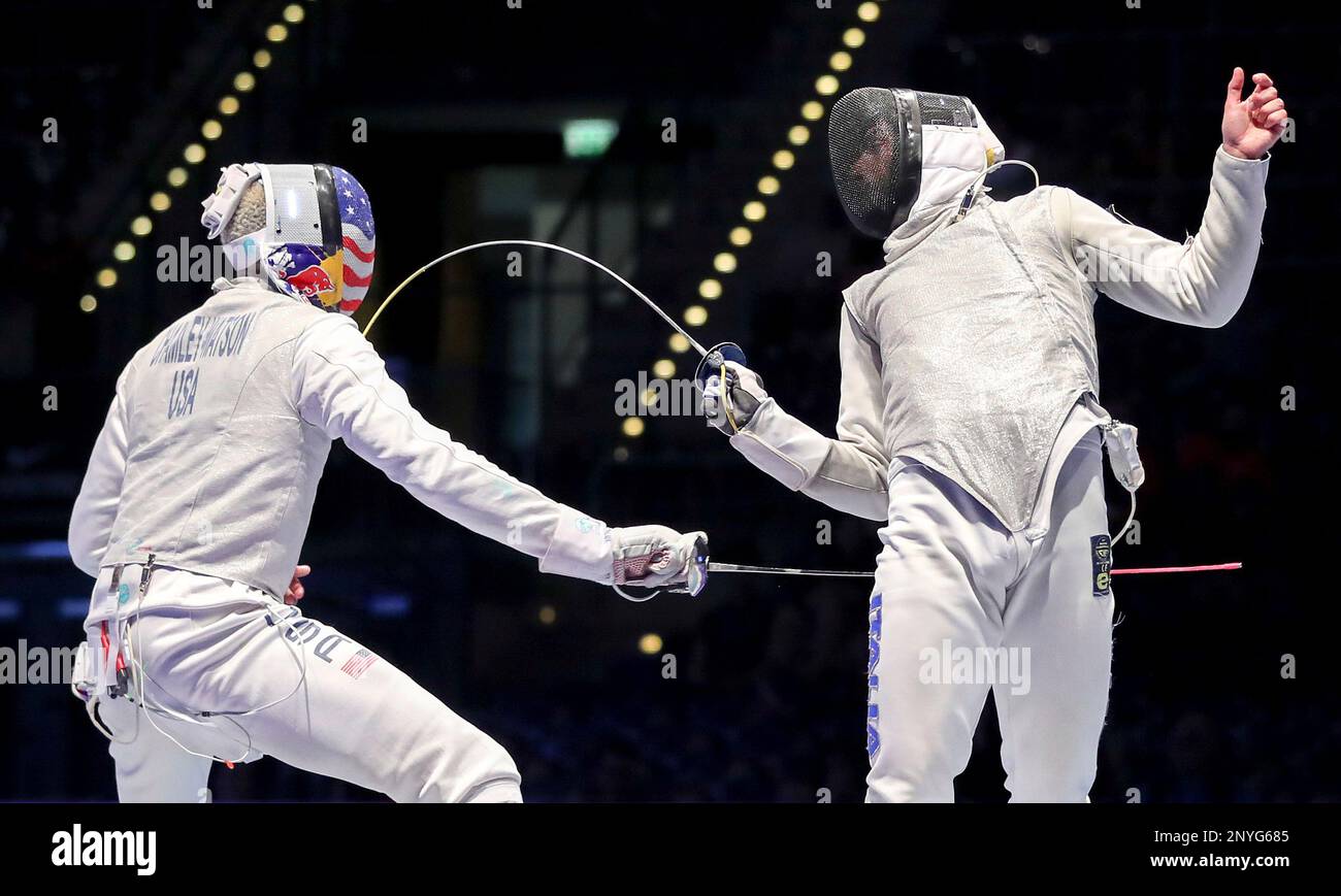 The foil fencer Miles Chamley-Watson, left, of the US in action against ...