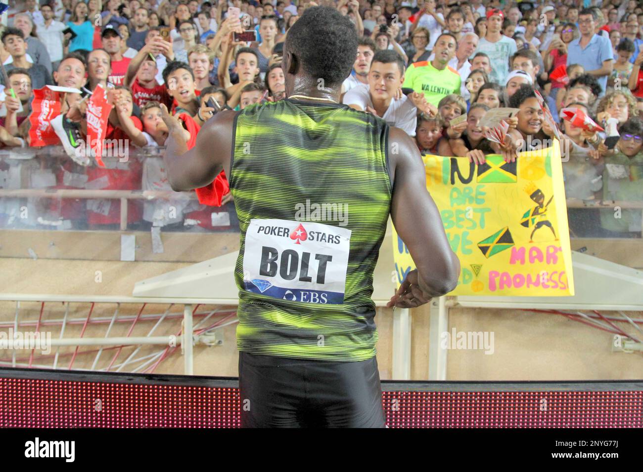 Usain Bolt (JAM) signs autographs for fans after winning the 100m in 9. ...