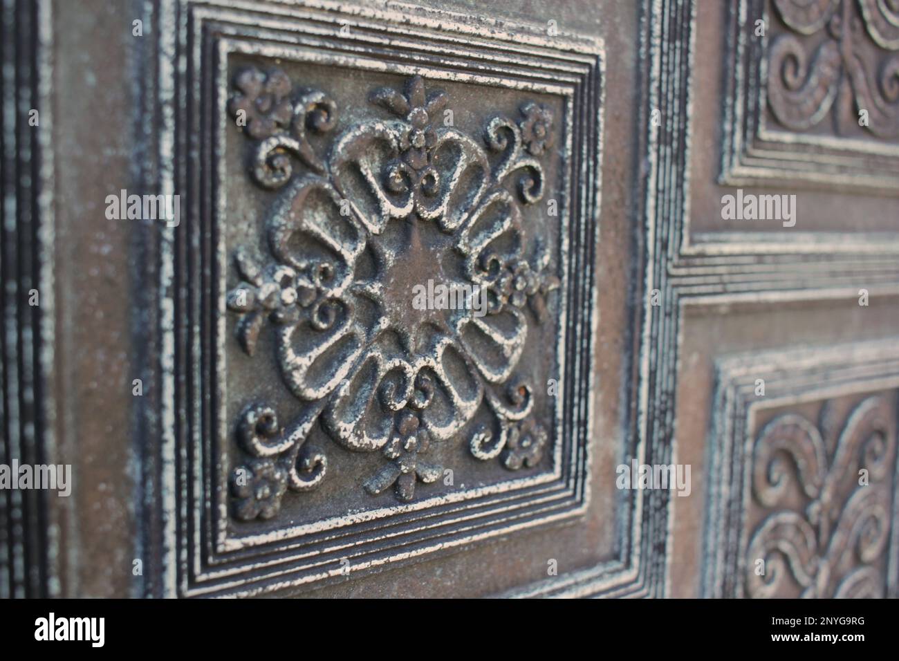 Vintage medieval decorative motif on a heavy duty copper metal wall ...