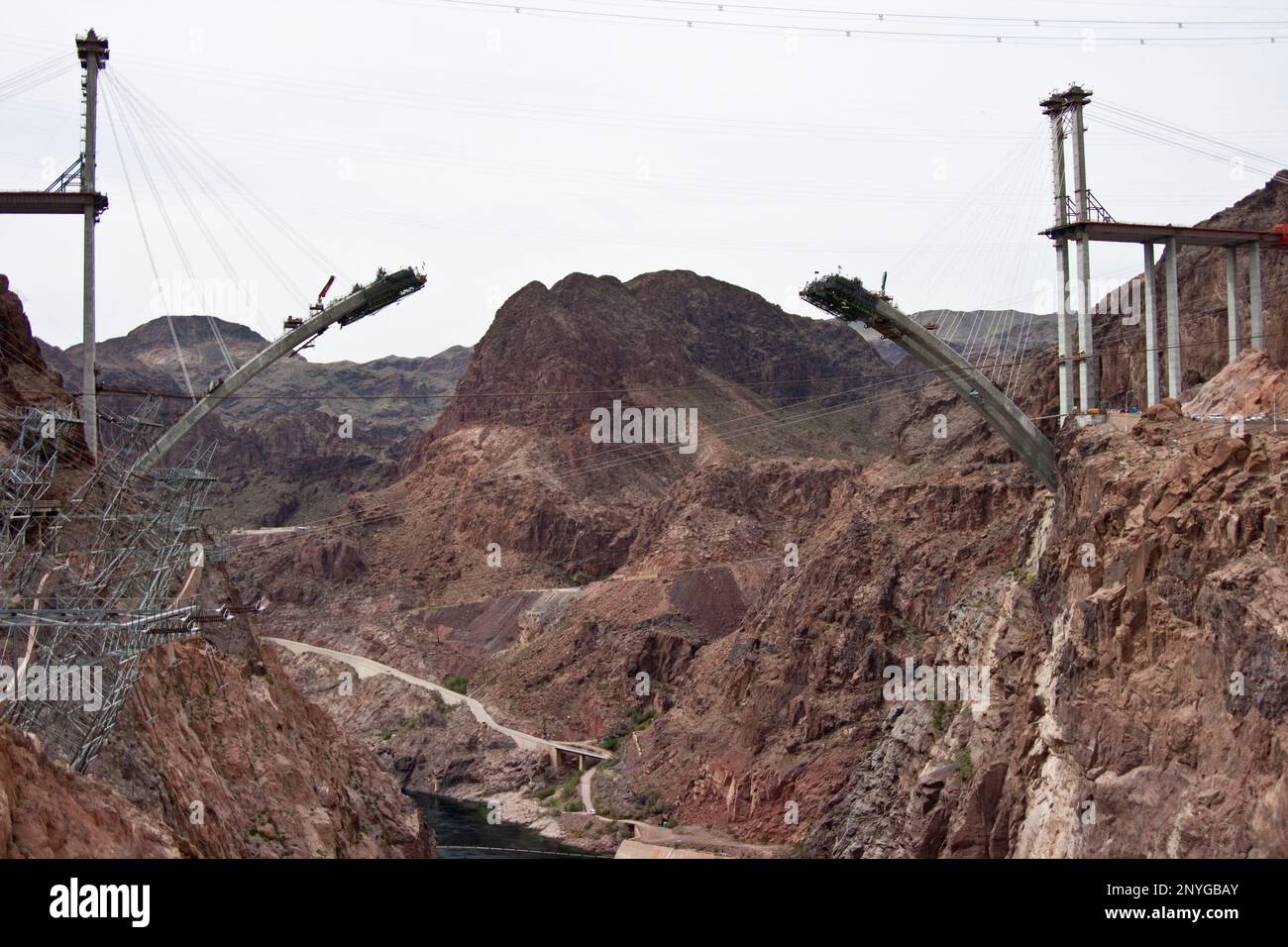 A majestic bridge extending over a tranquil body of water, set against ...