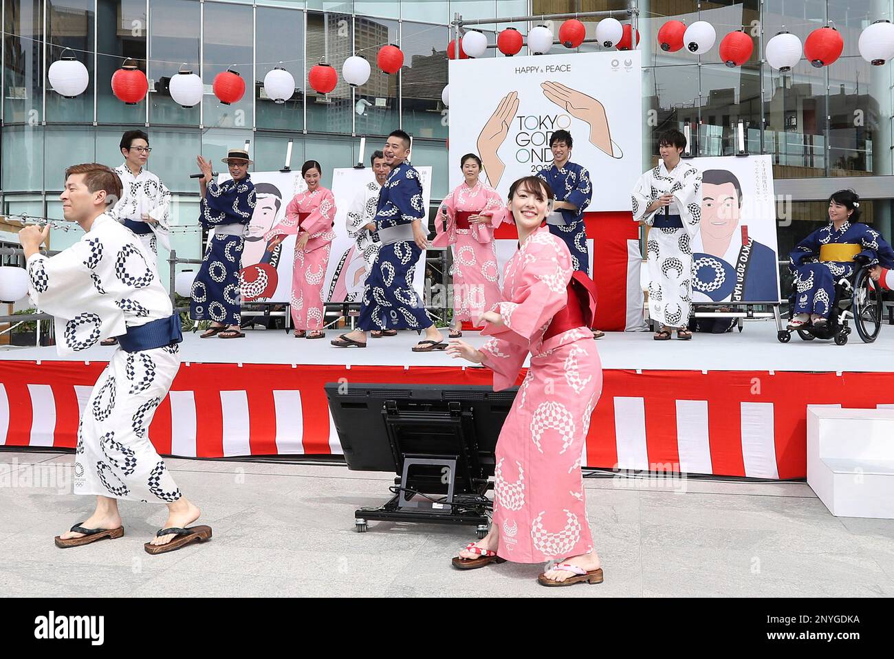 People clad in yukata (Japanese summer kimono with emblem design of the ...