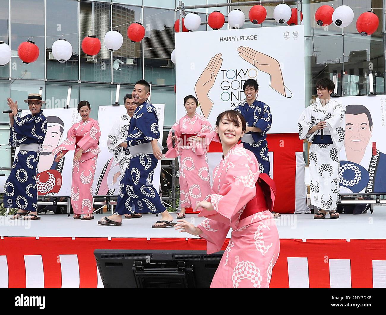 People clad in yukata (Japanese summer kimono with emblem design of the ...