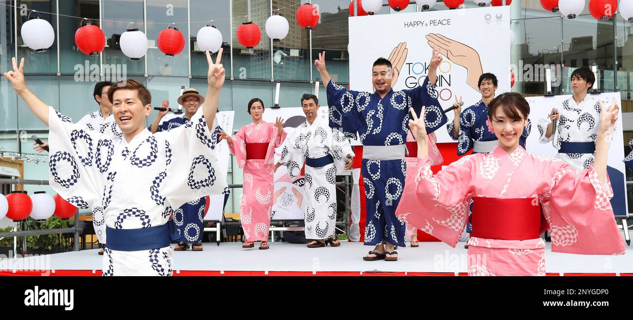 People clad in yukata (Japanese summer kimono with emblem design of the ...