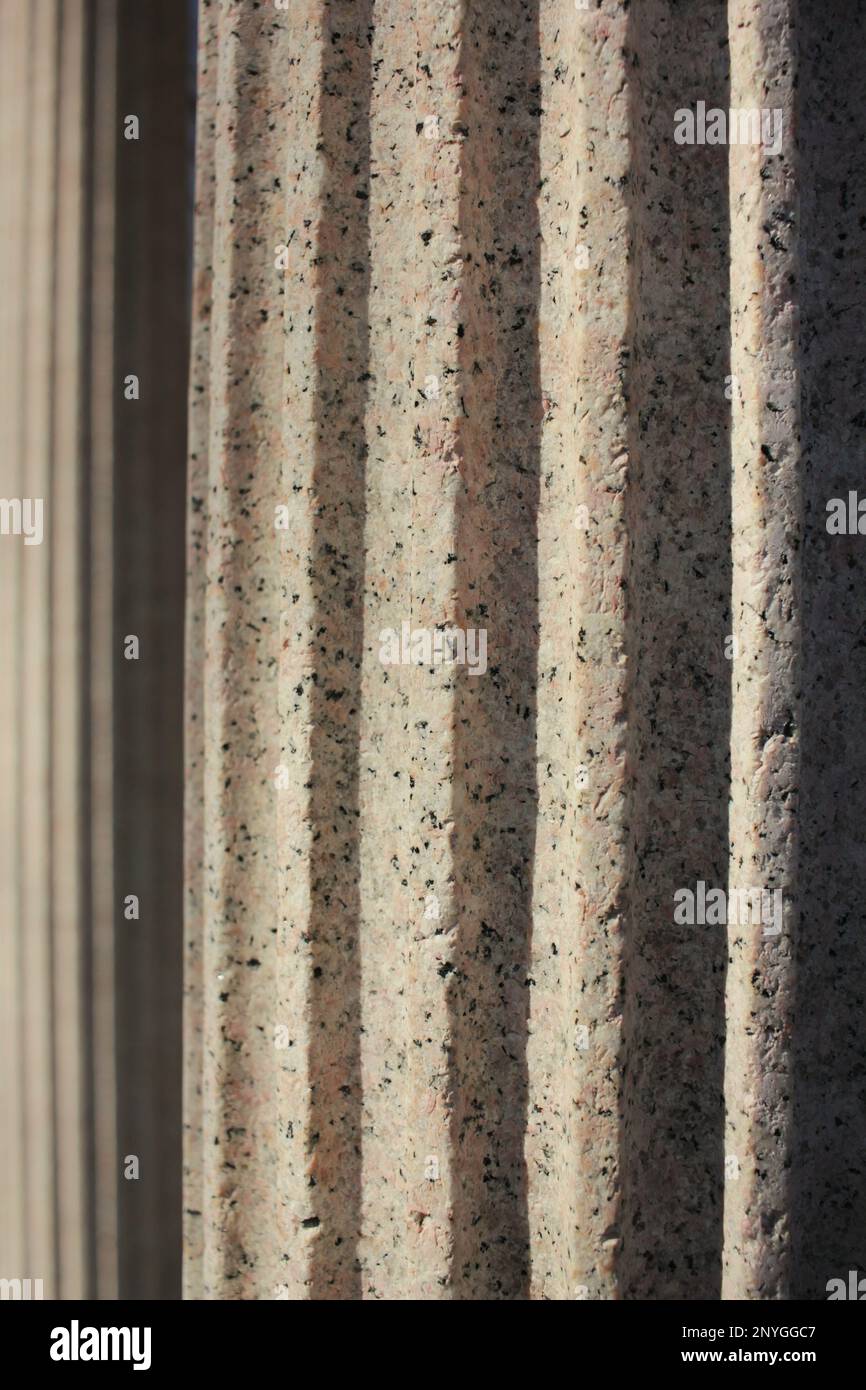 A closeup view of a fluted column carved in natural stone Stock Photo ...