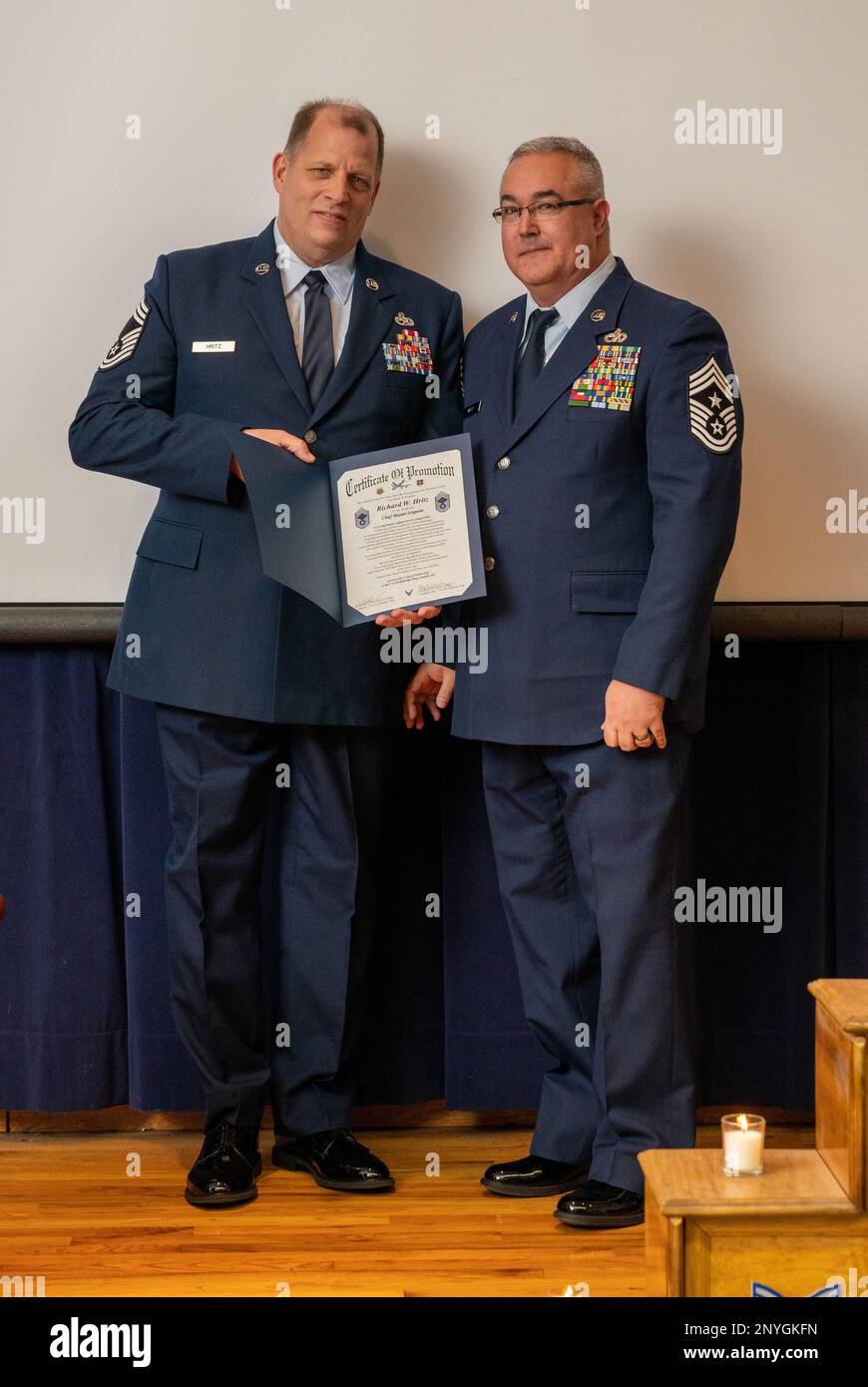 Chief Master Sgt. Rich Hritz, left, is presented a certificate from ...