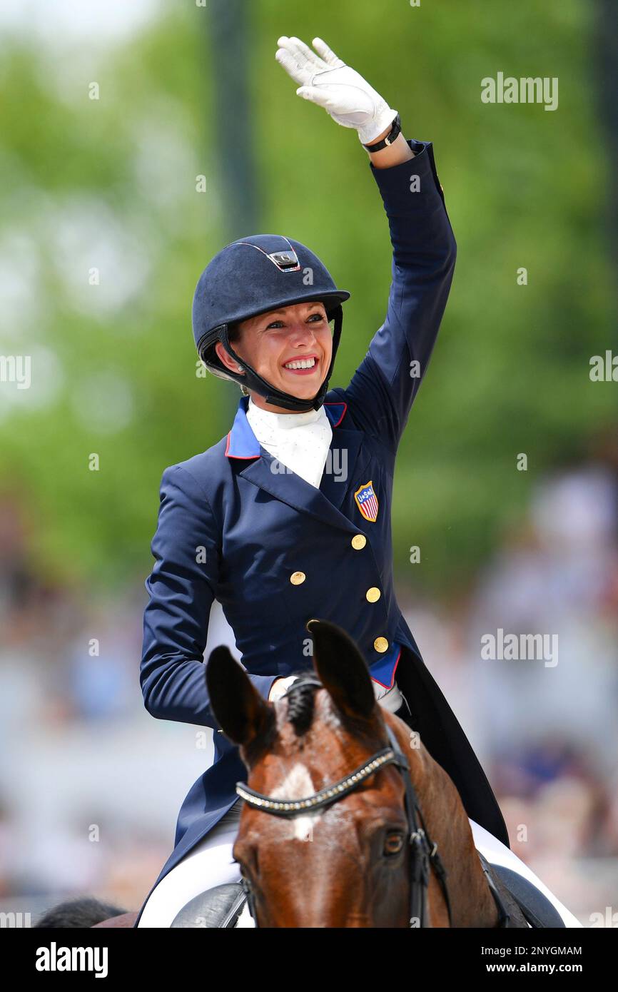 Dressage rider Laura Graves of the U.S. on her horse Verdades waves ...