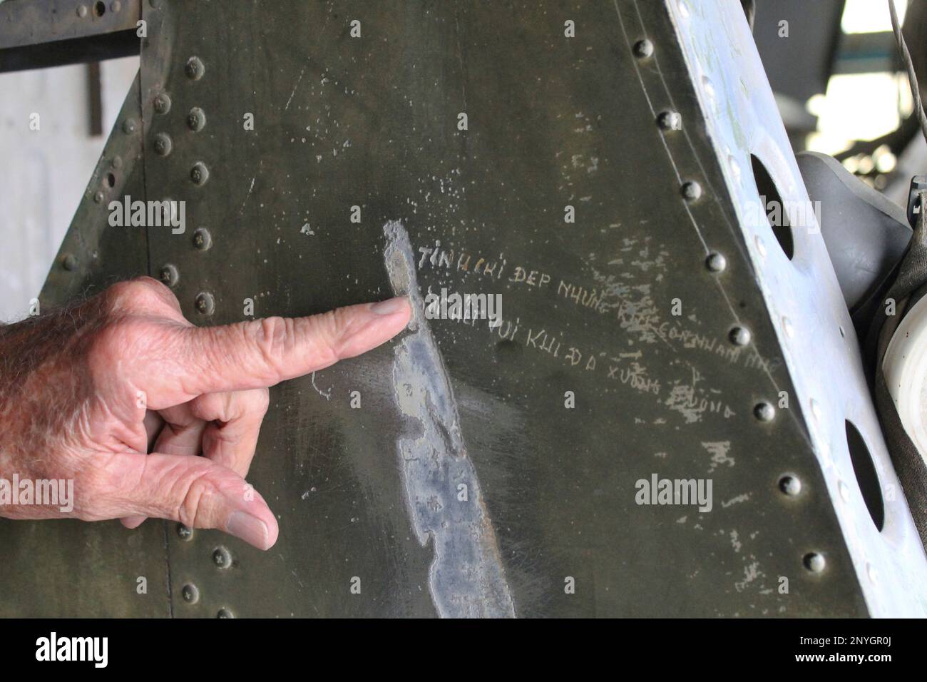 This July 10, 2017 photo, Bob Fritzler points to an inscription left by ...