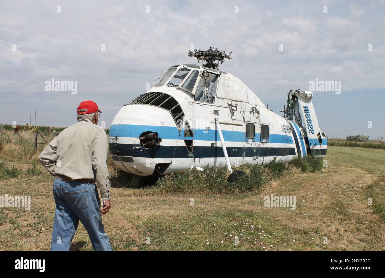 In this July 10, 2017 photo, Bob Fritzler stands in front an old blue ...