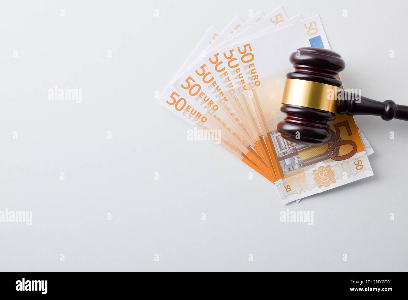 Concept of financial judgment with gavel on heap of banknotes isolated ...