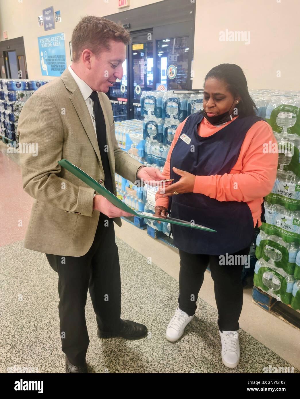 Mr. Trevor Loew MWR Director, USAG Fort Hamilton (L), recognized Mrs ...
