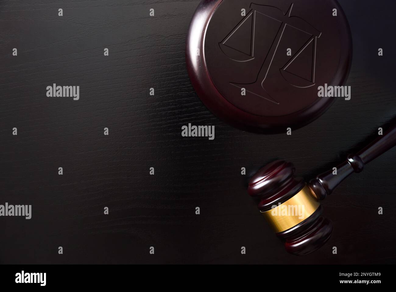 Background with symbolic objects of justice such as gavel and balance ...