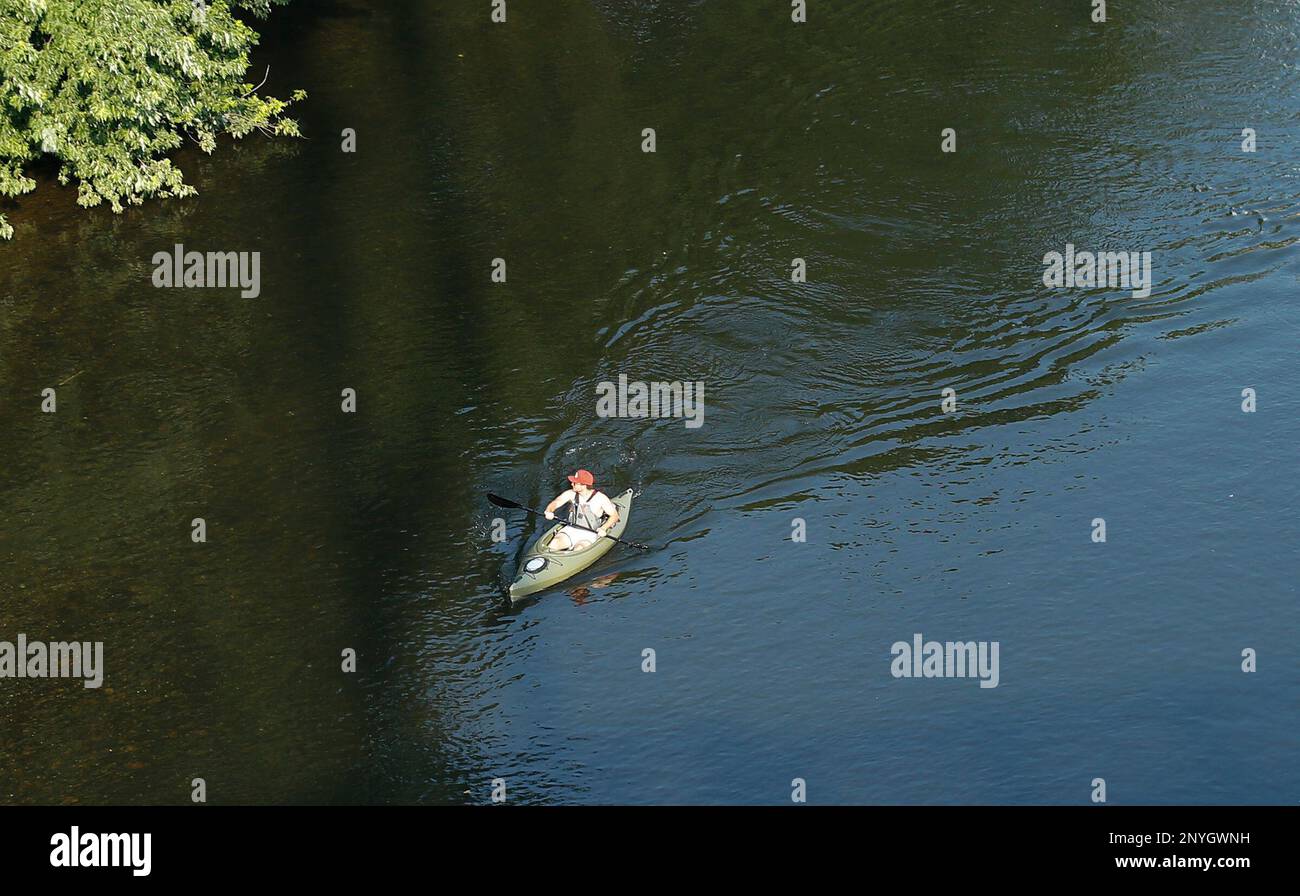 A kayaker paddles along the Schuylkill River in the Manayunk section of ...