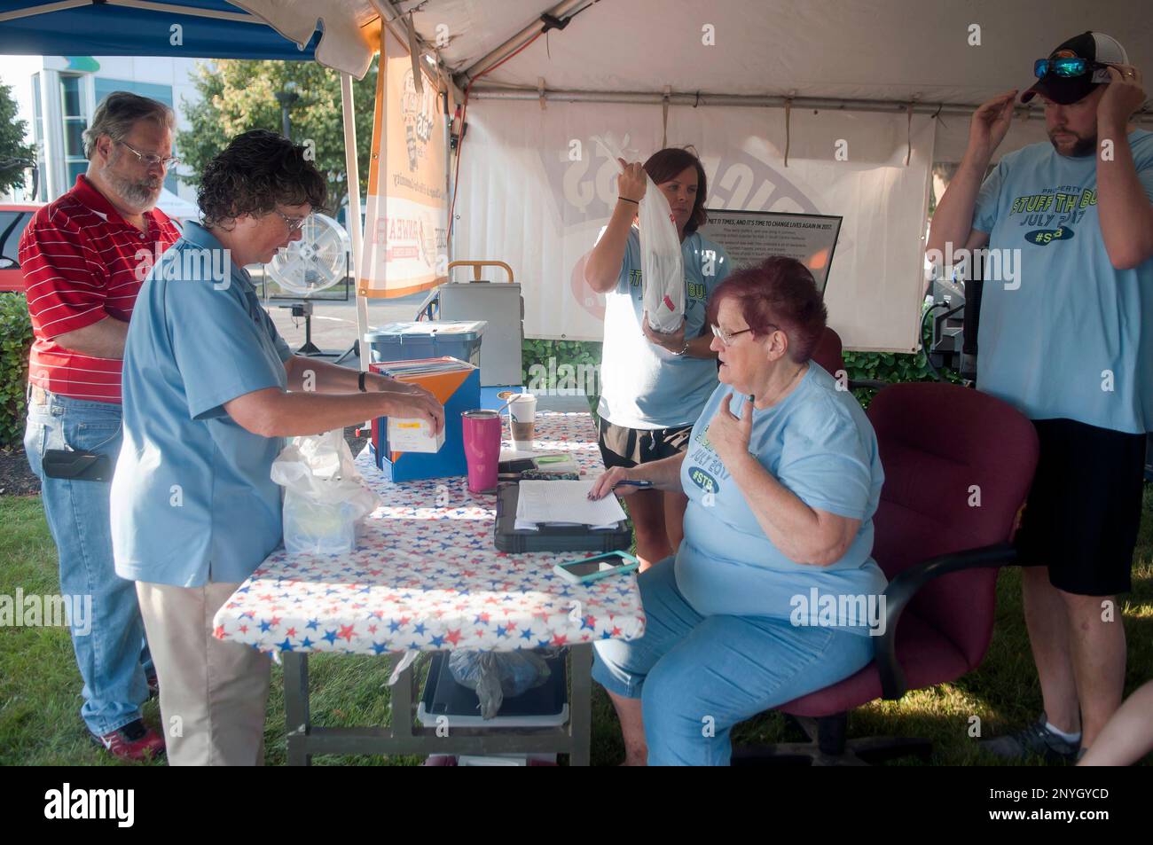 Eric Lindgren, left. and his wife Kim Lindgren drop off school supplies ...