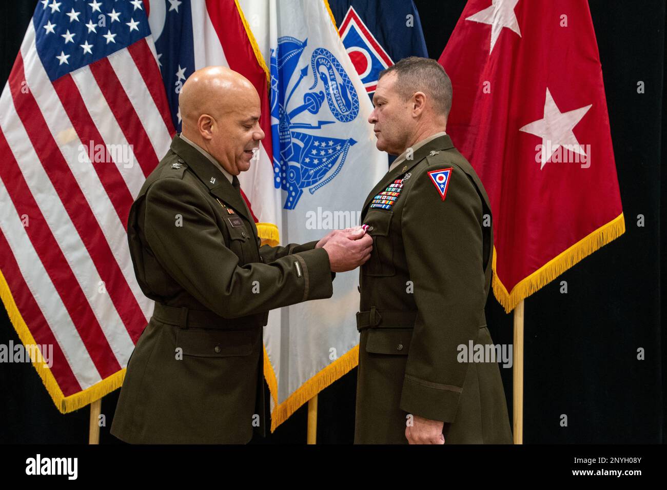 Maj. Gen. John C. Harris Jr., left, Ohio adjutant general, presents the ...