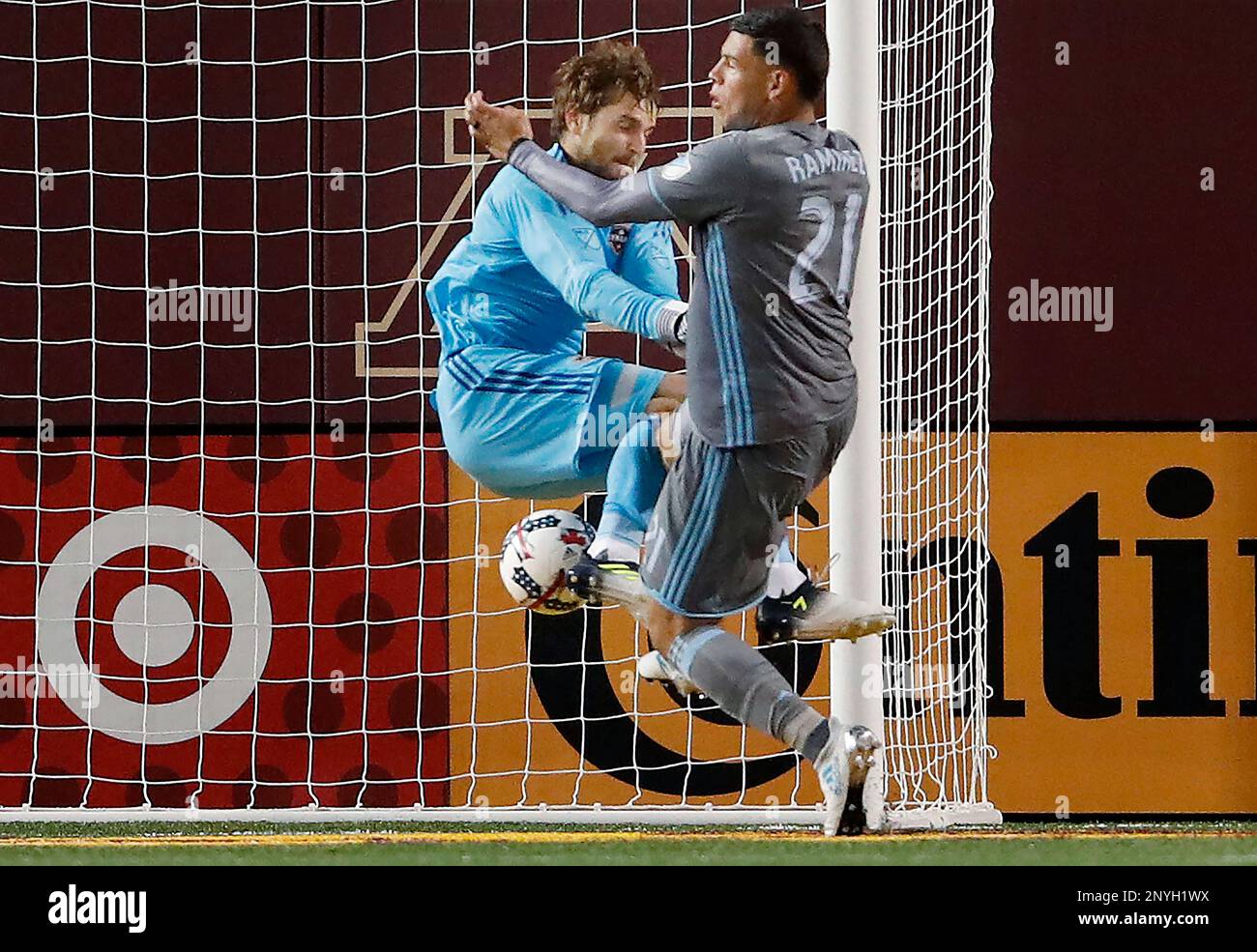 Minnesota United's Christian Ramirez (21) collides with Houston Dynamo ...