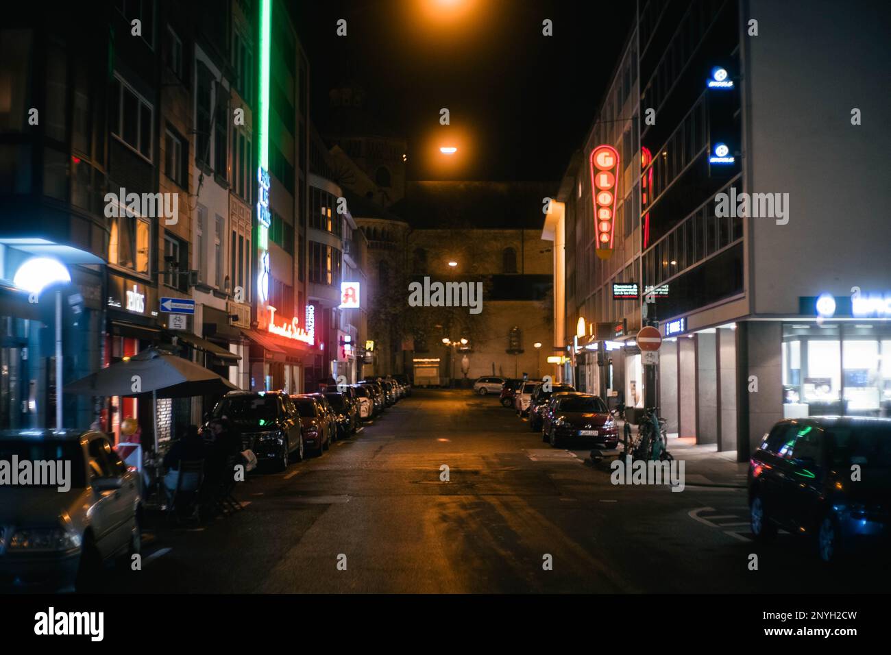 A horizontal shot of the Apostelnstrasse in Cologne at night. You can ...