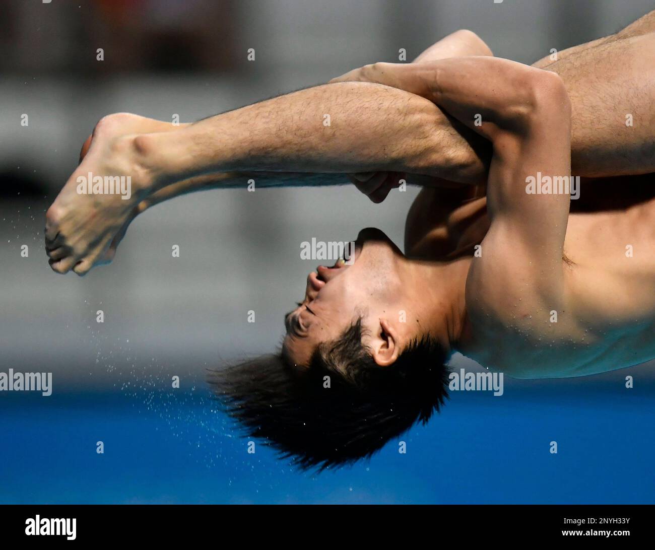 Sakai Sho of Japan competes in the men's diving 3m springboard ...