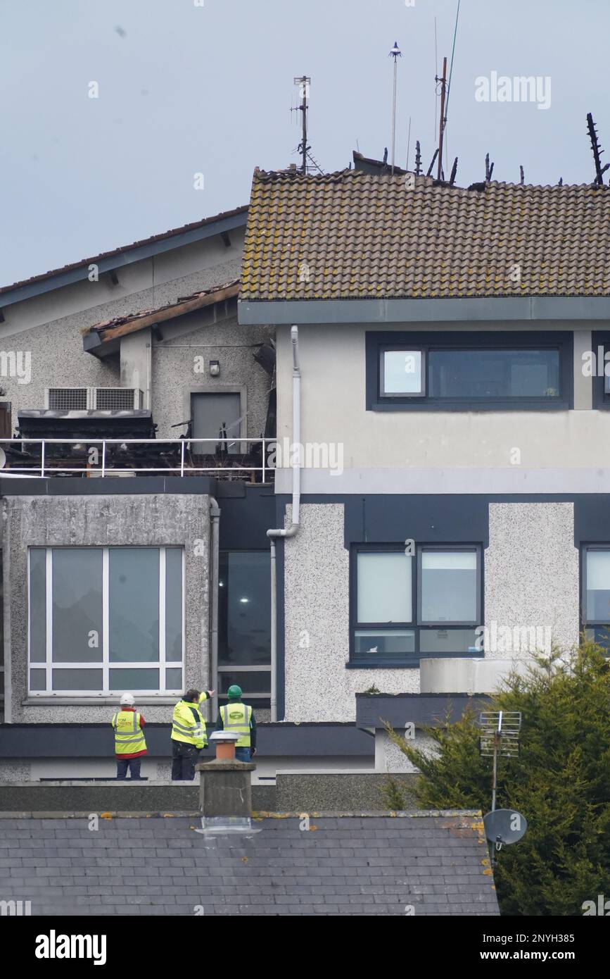 People inspect the damage to the roof of Wexford General Hospital after ...