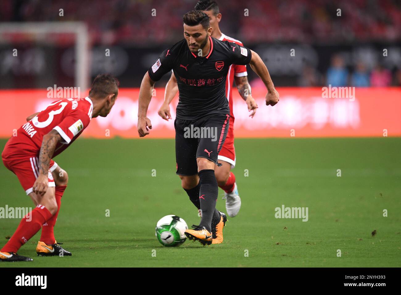 Bosnian football player Sead Kolasinac, right, of Arsenal kicks the ...