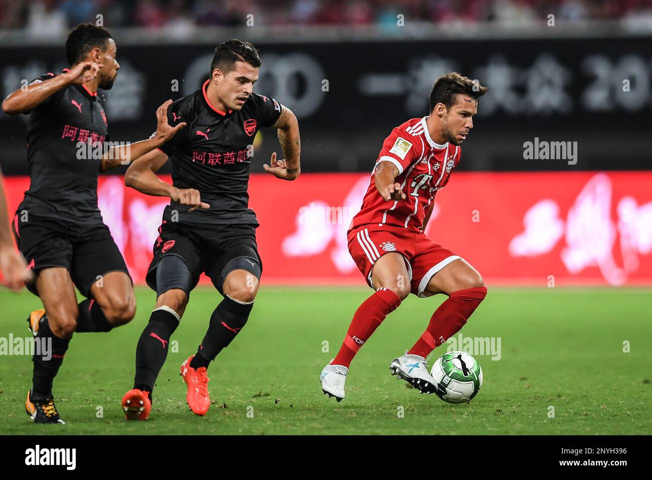 Spanish football player Juan Bernat, right, of Bayern Munich kicks the ...