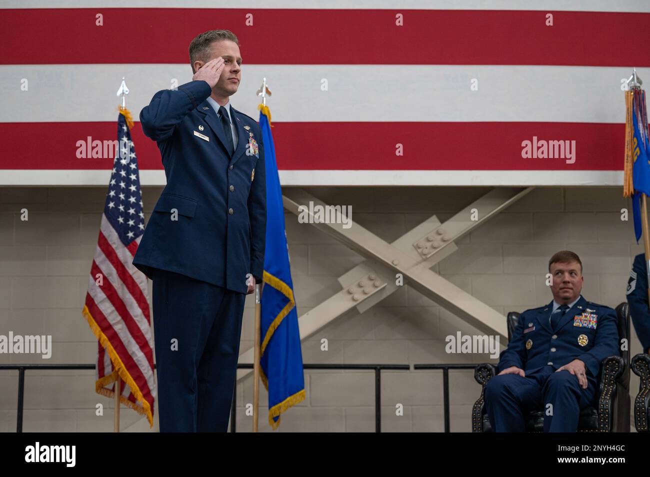 Lt. Col. Sean Stumpf, incoming 40th Airlift Squadron commander, renders ...
