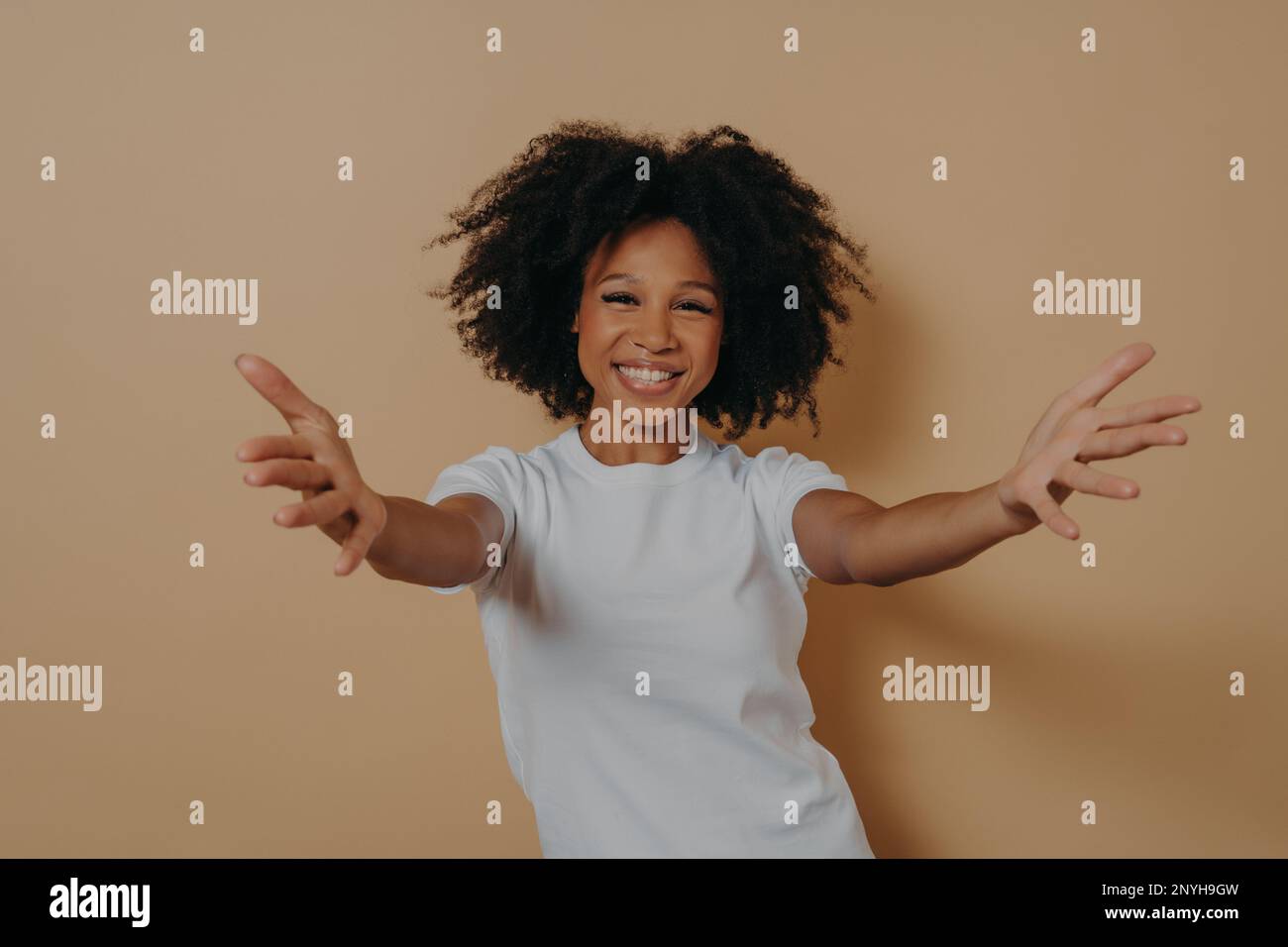 Nice to meet you. Overjoyed happy african woman 20s standing isolated ...