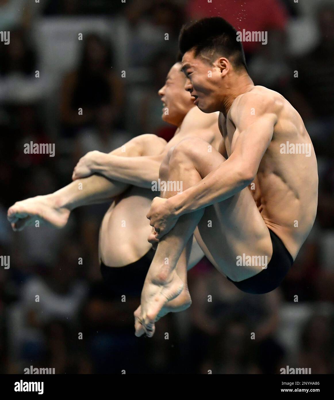 Hyon Il Myong and Ri Hyon Ju of North Korea compete in the men's 10m ...