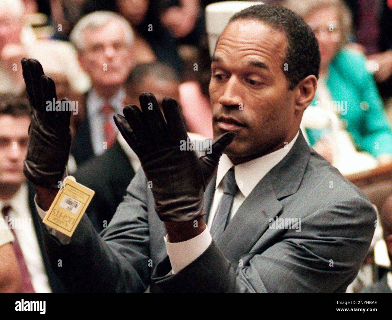 FILE - In this June 21, 1995 file photo, O.J. Simpson holds up his hands before the jury after ...