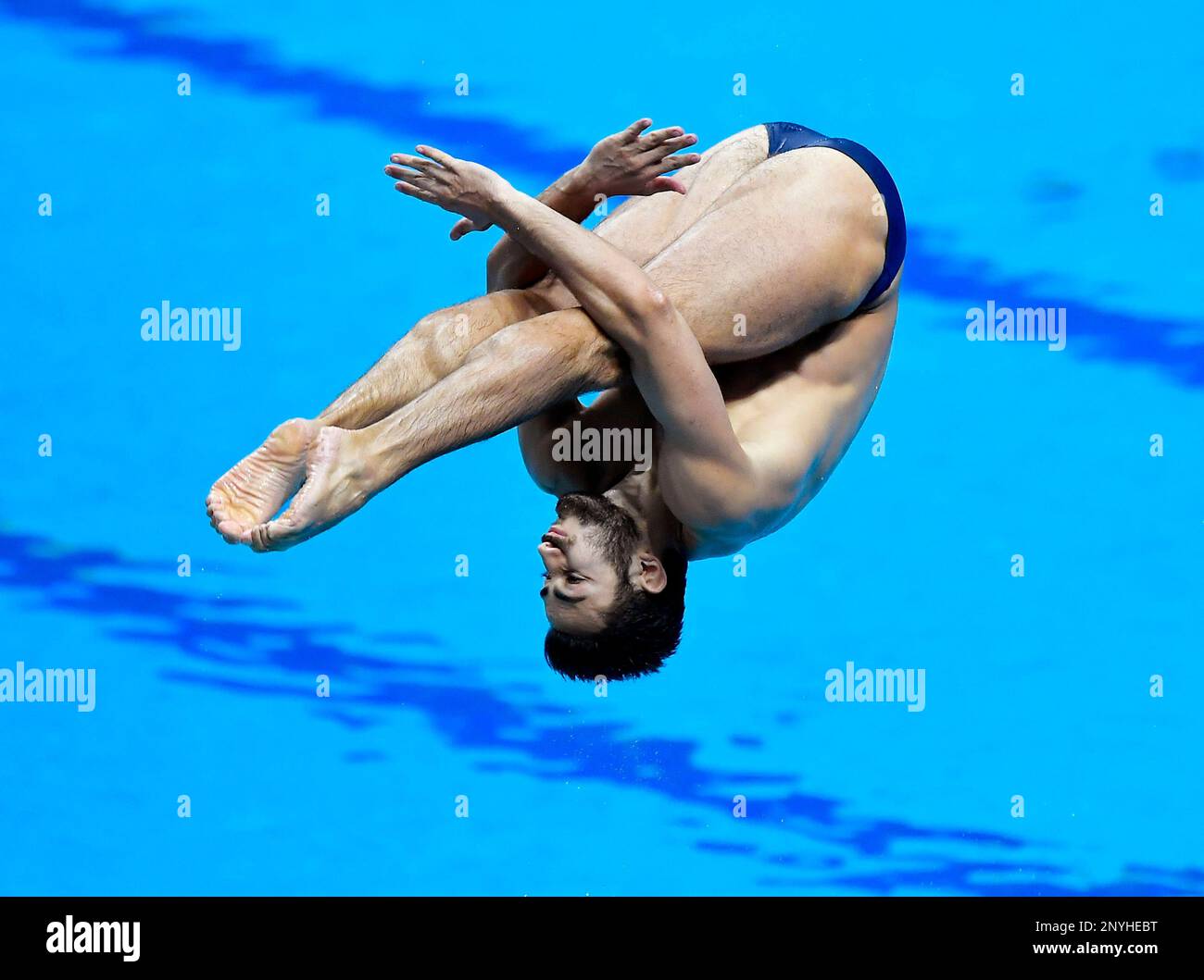 Giovanni Tocci of Italy competes in the men's diving 1m springboard ...