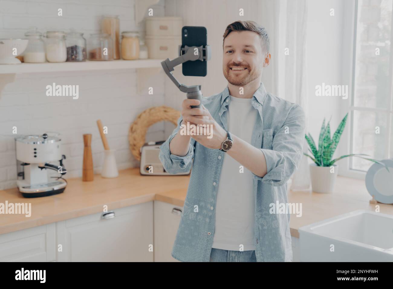 Young man blogger recording video blog or live streaming with ...