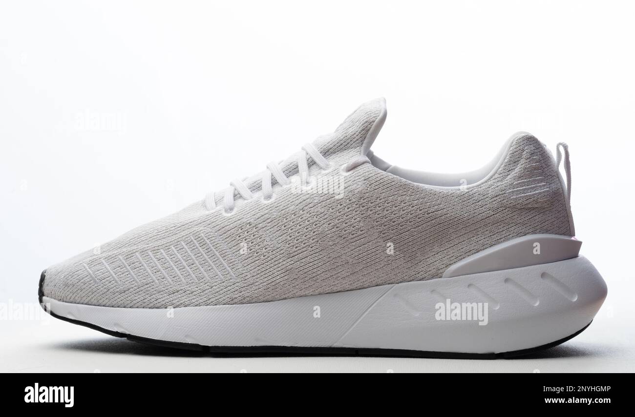 Side view of training sport shoe isolated on white studio background ...