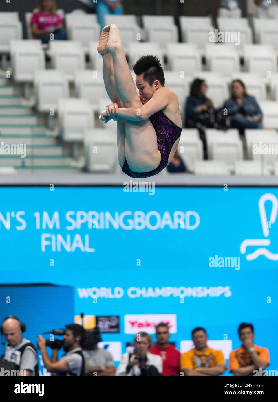 Yiwen Chen of China competes in the women's diving 1m springboard final ...