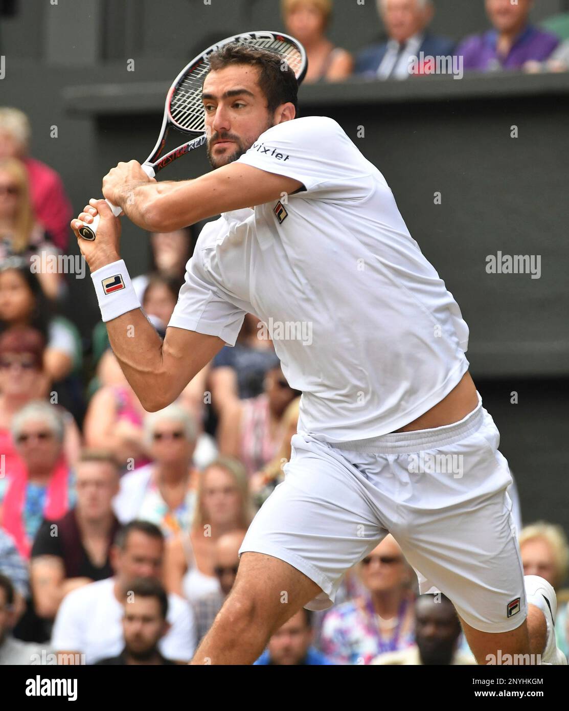 Marine Cilic of Croatia hits a shot during the Gentlemen' singles semi ...
