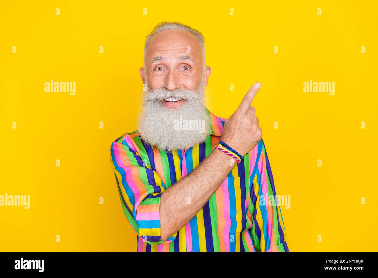 Photo of sweet funky guy dressed striped shirt pointing finger empty ...