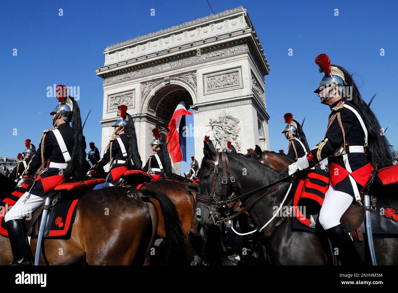 French Republican Guards ride their horse pas the Arc de Triomphe in ...