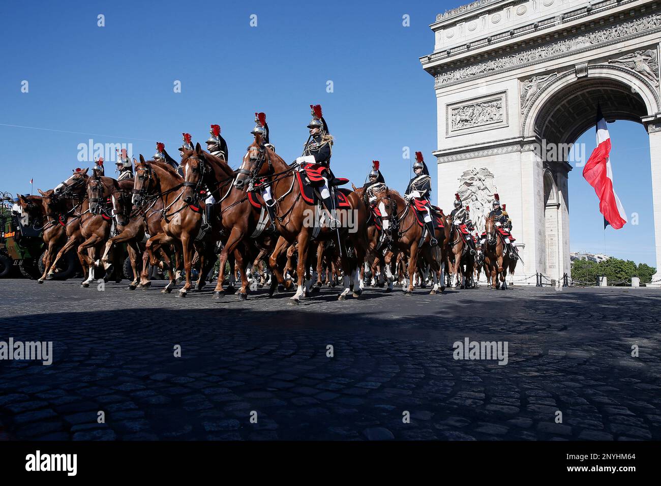 French Republican Guards ride their horse past the Arc de Triomphe in ...