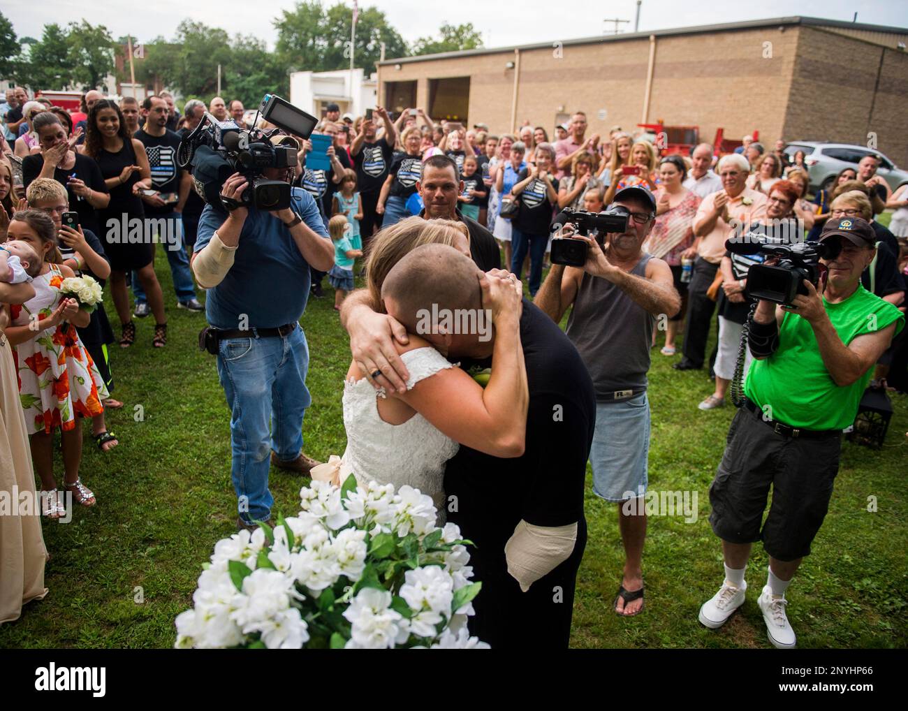 Leechburg Police Chief Mike Diebold embraces his wife Danielle Reinke ...