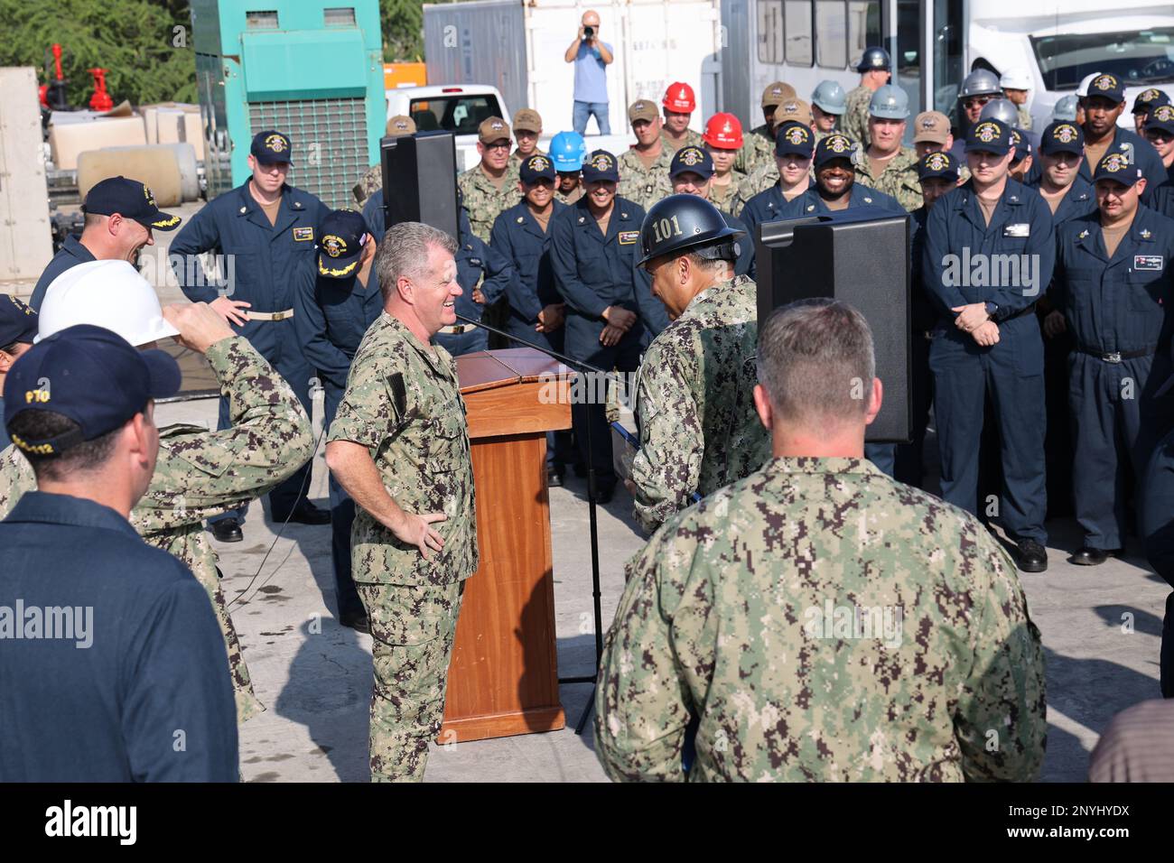 Adm. Samuel Paparo, commander, U.S. Pacific Fleet, accepts a book from ...