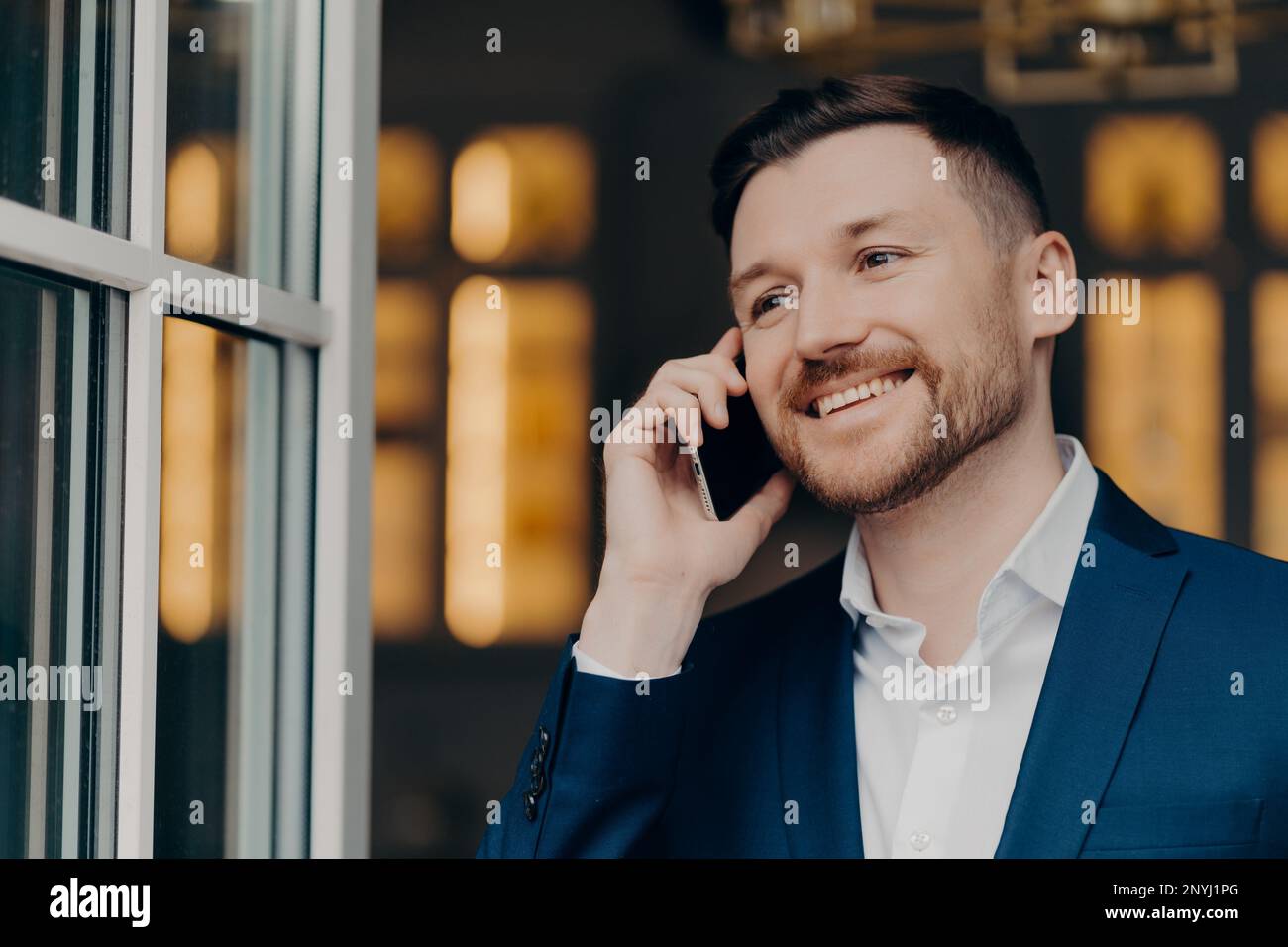 Handsome man looks happy talking hi-res stock photography and images ...