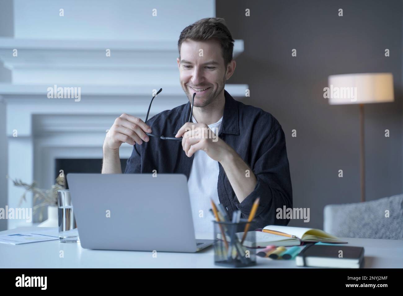 Smiling German businessman ready to start online representation of new ...