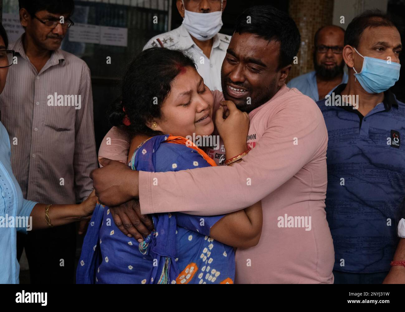 A couple cries after the death of their child who succumbed to Acute ...