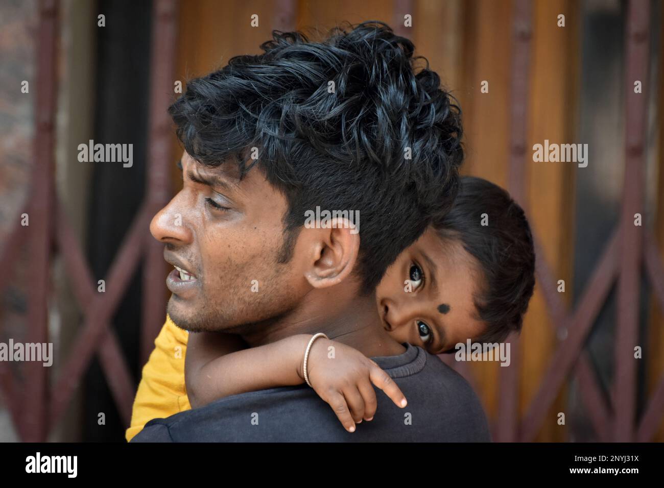 A man carries his child suffering from Acute Respiratory Infection (ARI ...