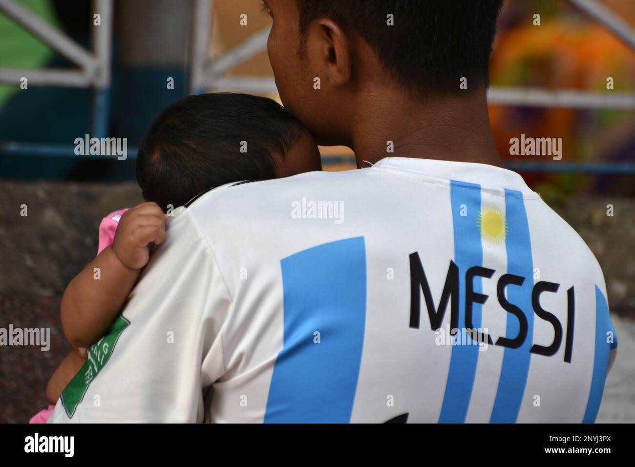 A man carries his child suffering from Acute Respiratory Infection (ARI ...