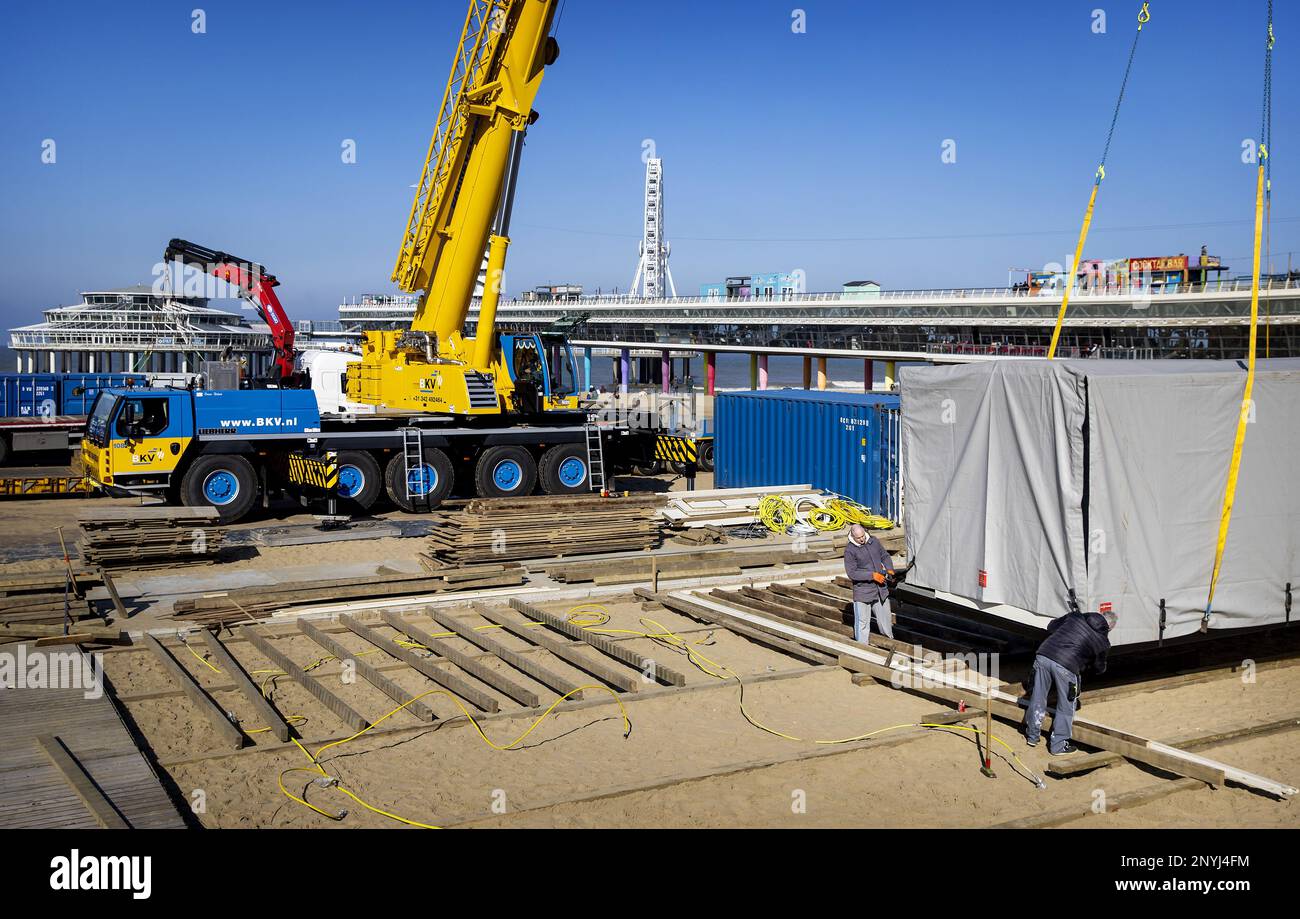 THE HAGUE - Work on the beach of Scheveningen where beach tents are ...