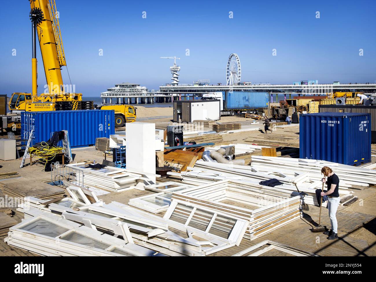 THE HAGUE - Work on the beach of Scheveningen where beach tents are ...