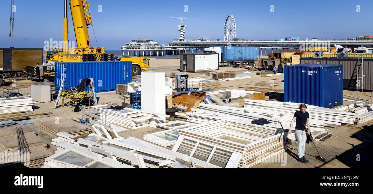 THE HAGUE - Work on the beach of Scheveningen where beach tents are ...