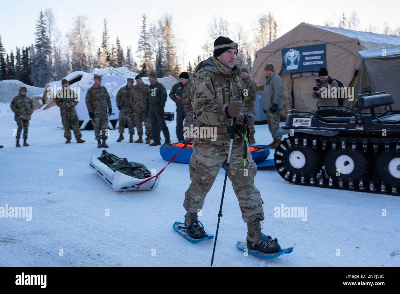 Members of the 673d Medical Group demonstrate a cold-weather casualty ...
