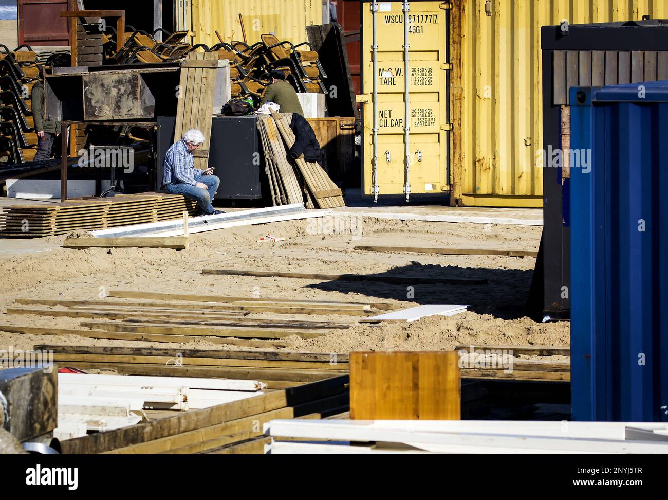 THE HAGUE - Work on the beach of Scheveningen where beach tents are ...