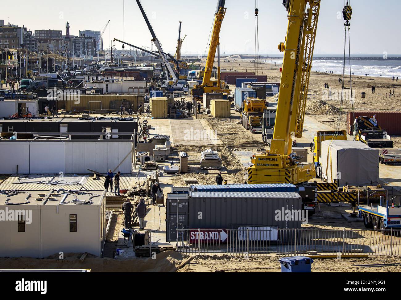 THE HAGUE - Work on the beach of Scheveningen where beach tents are ...
